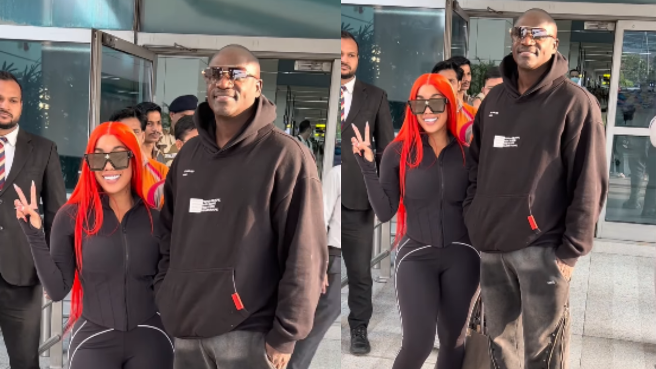Akon and his wife Tomeka engage with paparazzi at the Delhi airport ...